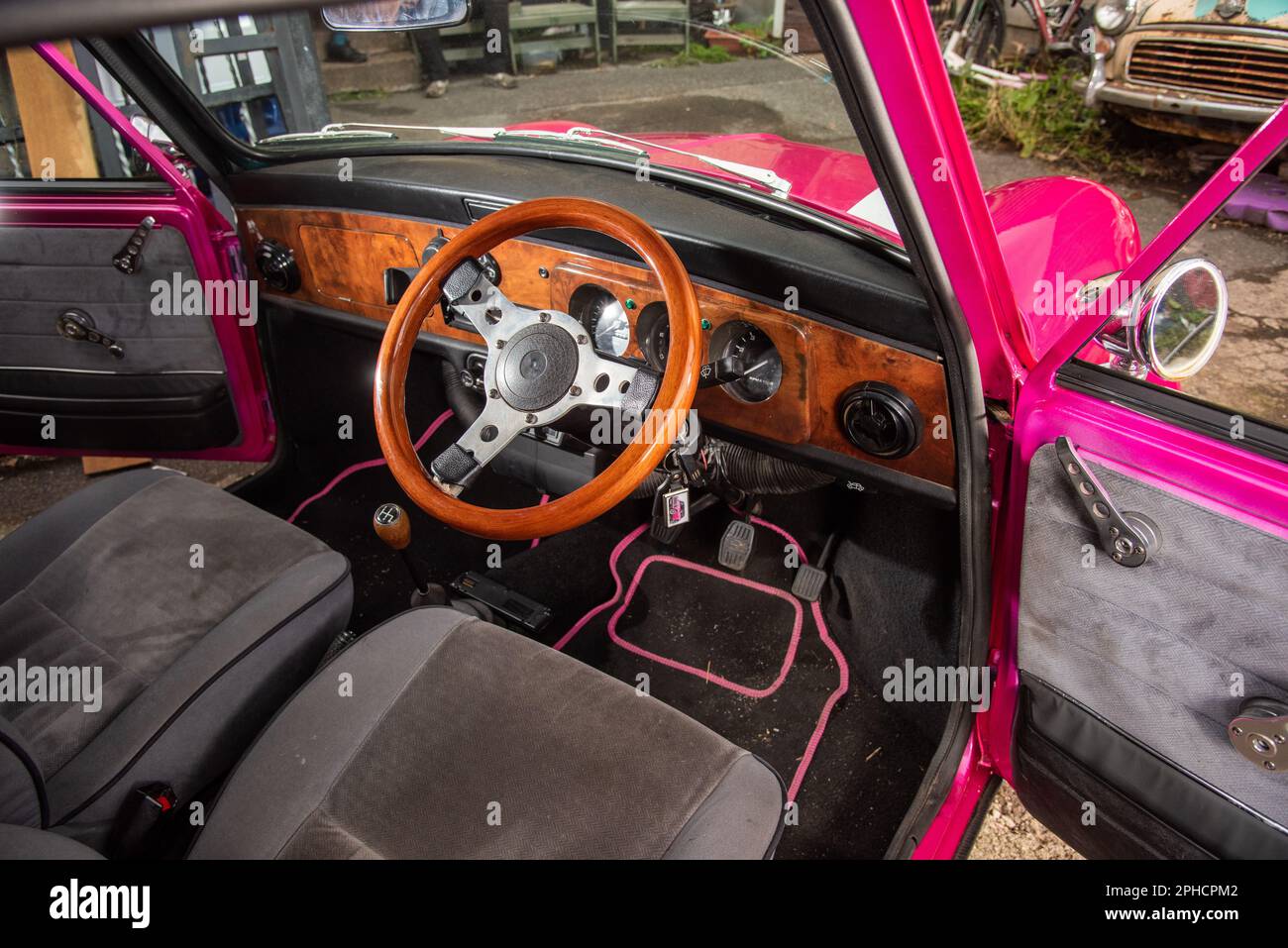 grey interior with wood steering wheel and trim on a classic Austin ...