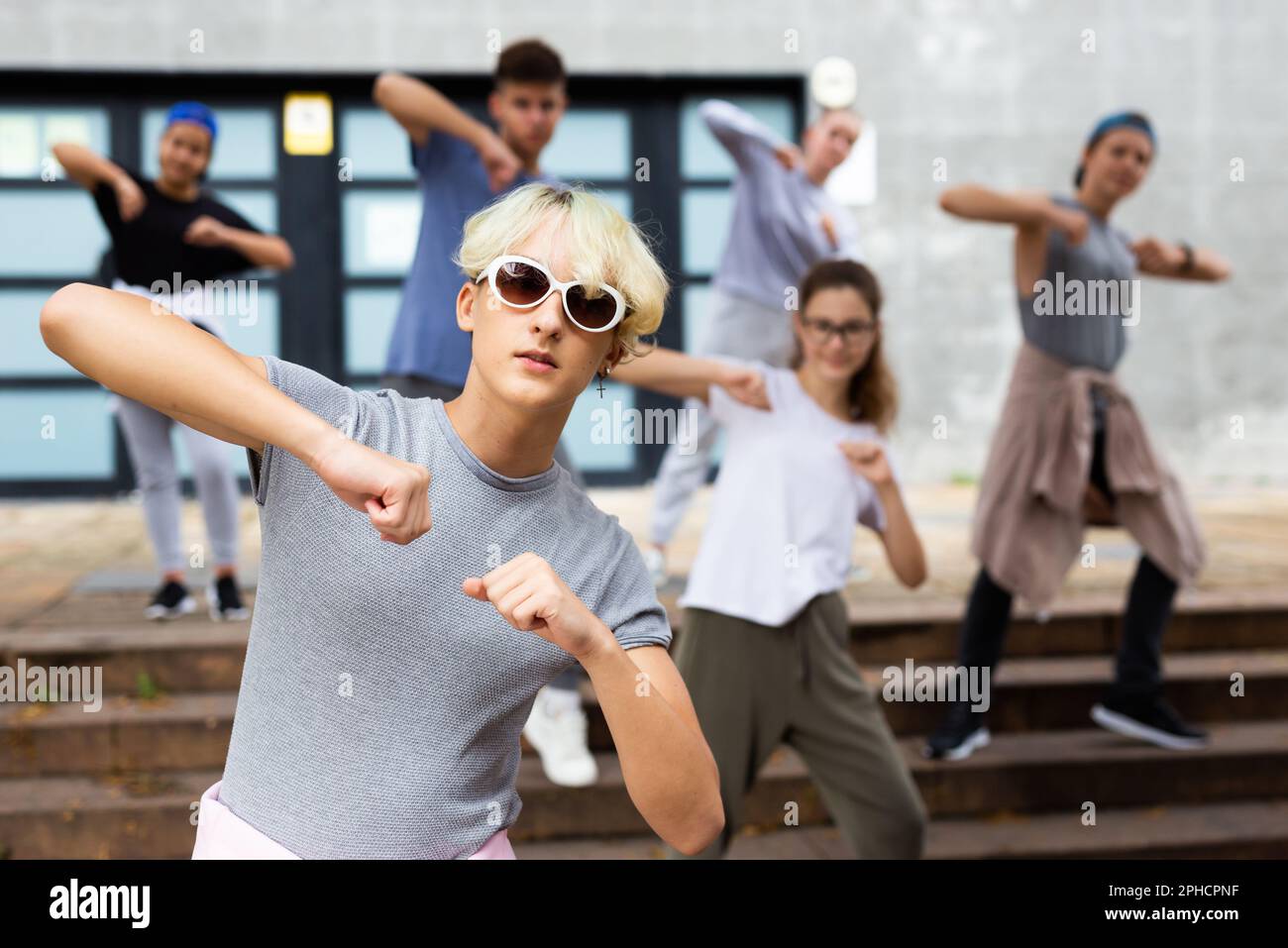Modern teenager performing street dance with group Stock Photo - Alamy