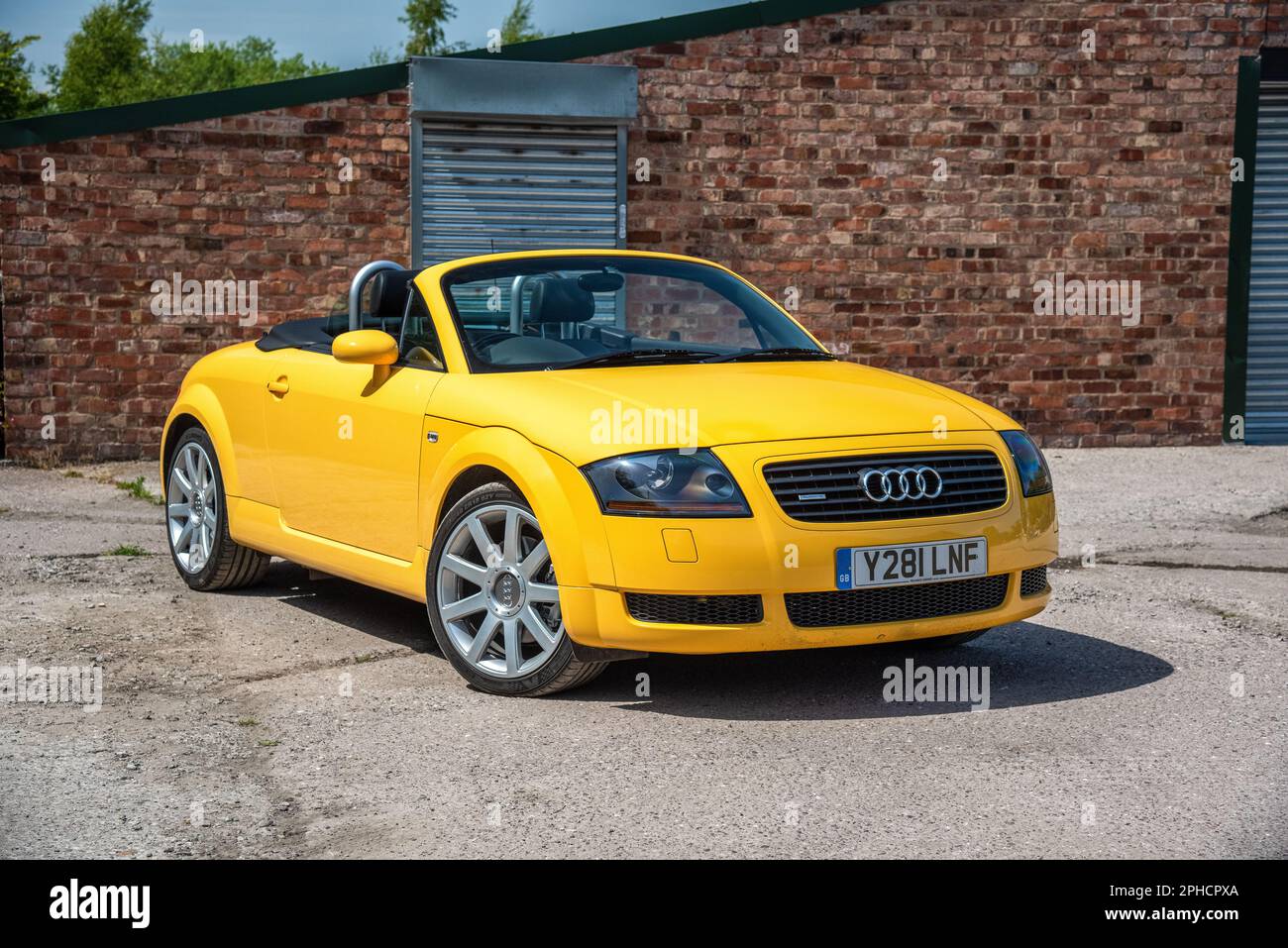 Bright yellow Audi TT convertible Stock Photo - Alamy