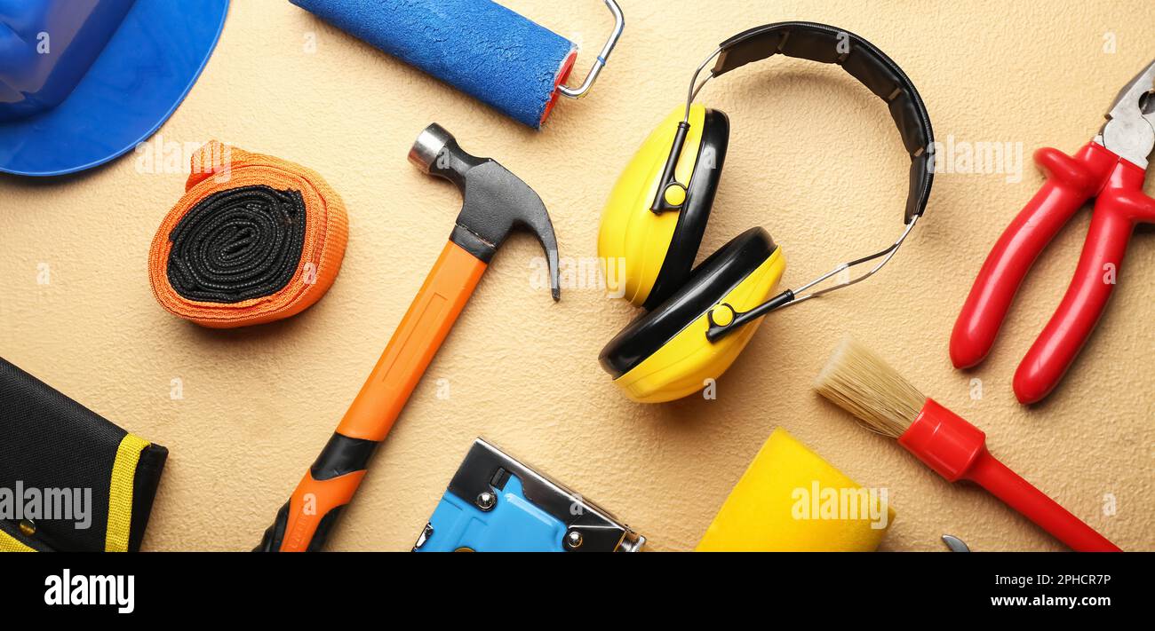 Set of carpenter's tools on beige background Stock Photo - Alamy