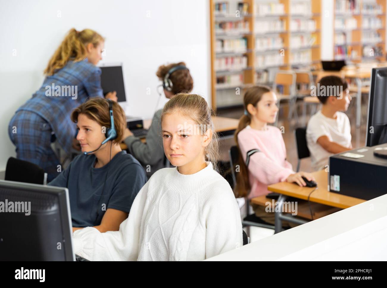 Teenager girls and boys studying in computer lab Stock Photo - Alamy