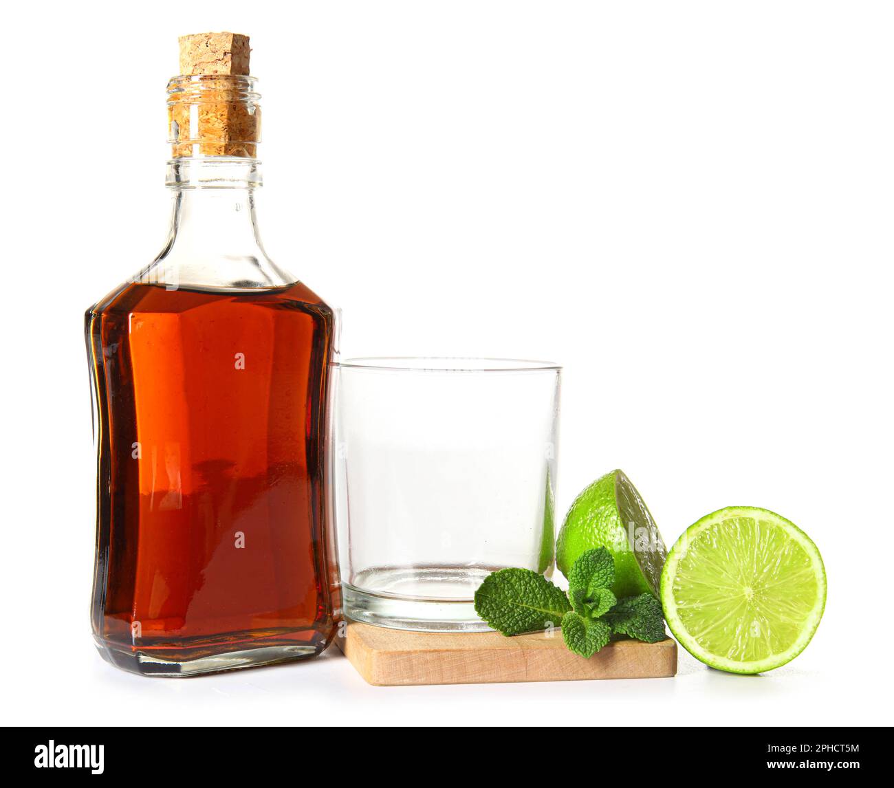 Bottle of rum, empty glass and lime on white background Stock Photo - Alamy