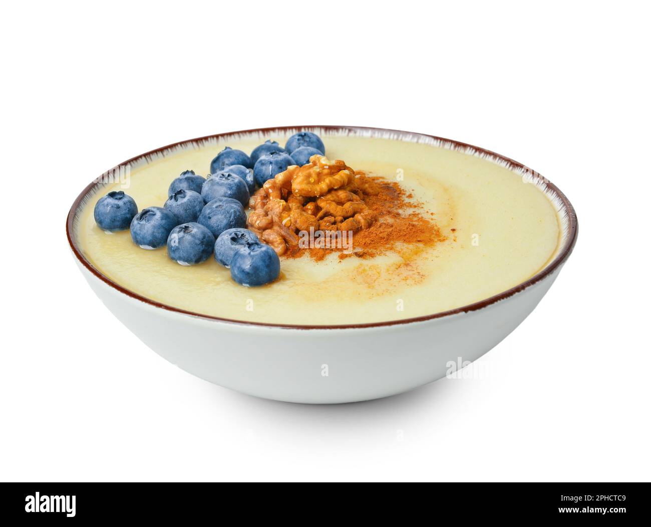 Bowl of tasty semolina porridge with blueberry and nuts on white ...