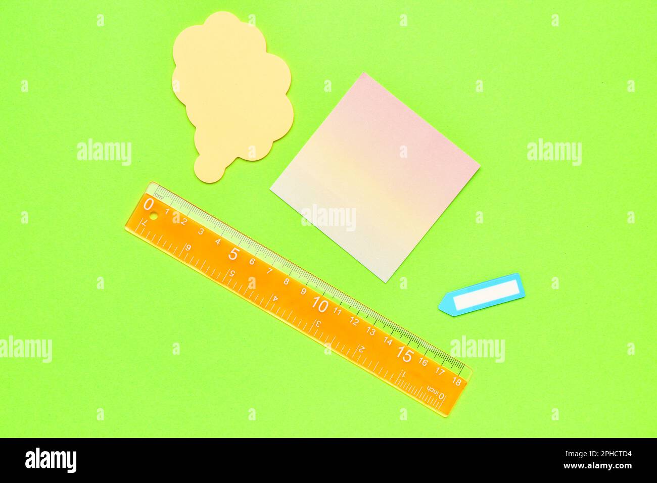 Composition with ruler and sticky notes on green background Stock Photo ...