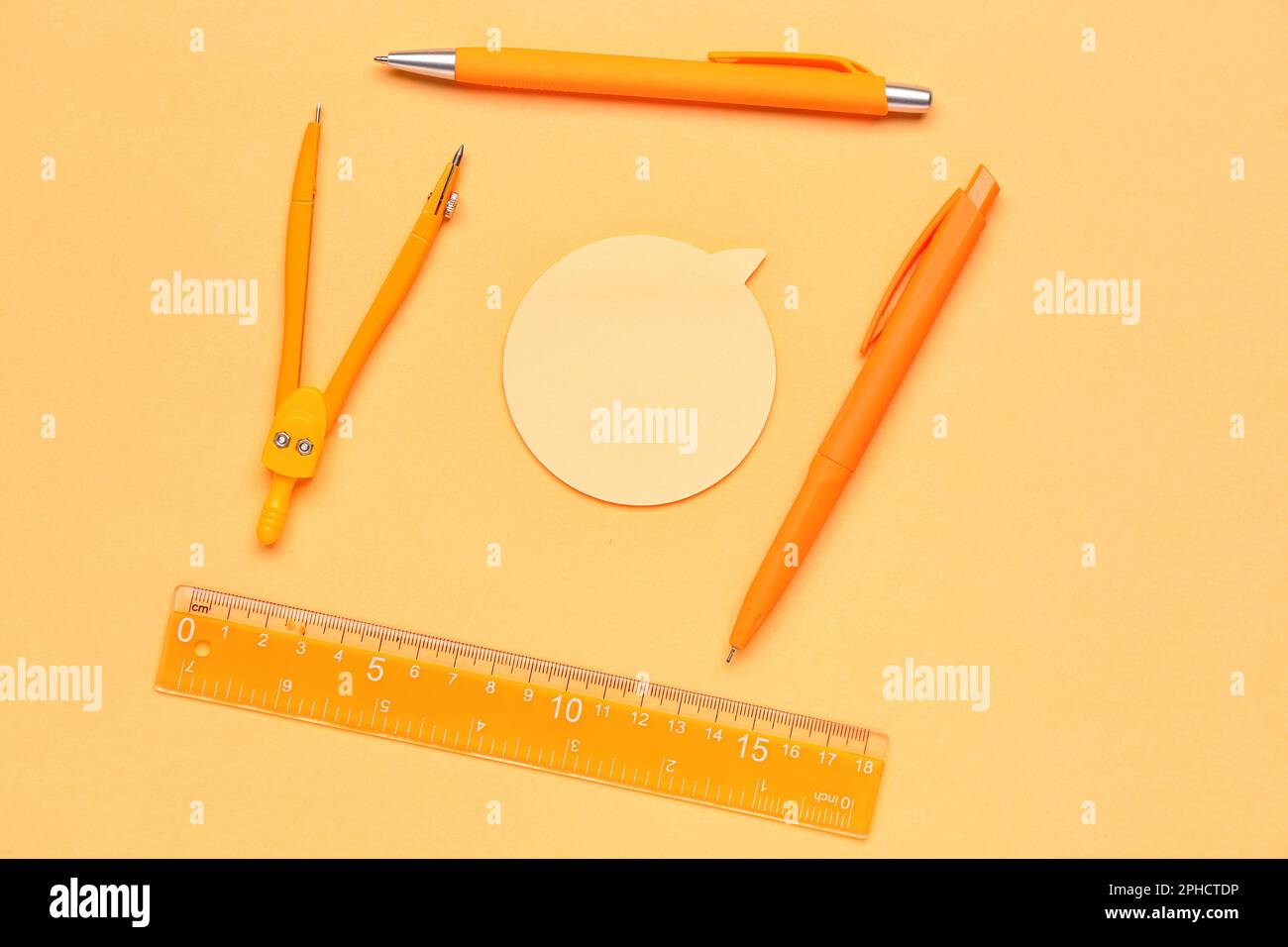 Composition with sticky note, pens and ruler on yellow background Stock ...