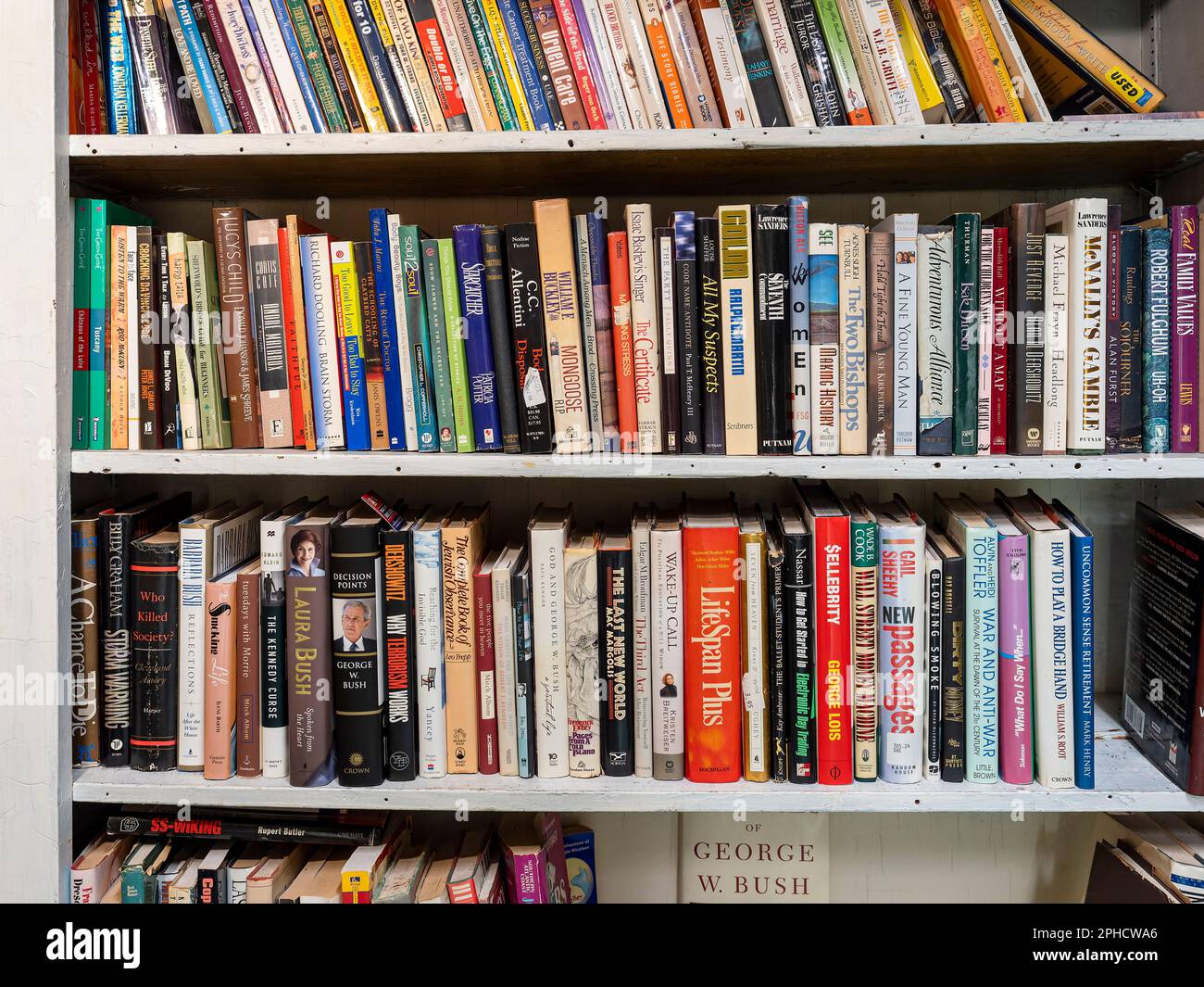 Old, used, recycled books on shelves in a used book store or flea ...