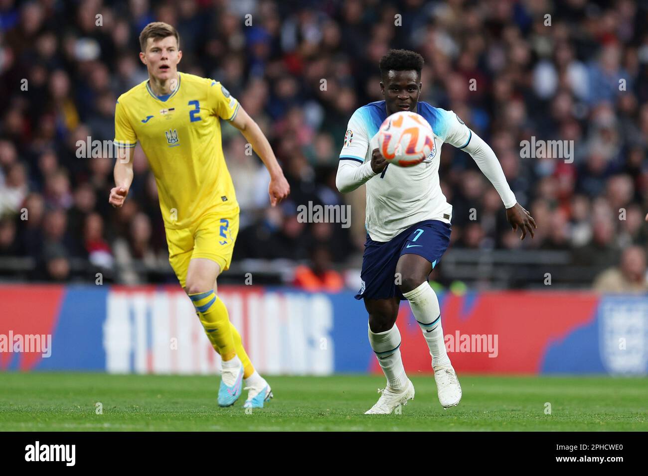 London, UK. 26th Mar, 2023. Bukayo Saka of England (r) in action ...