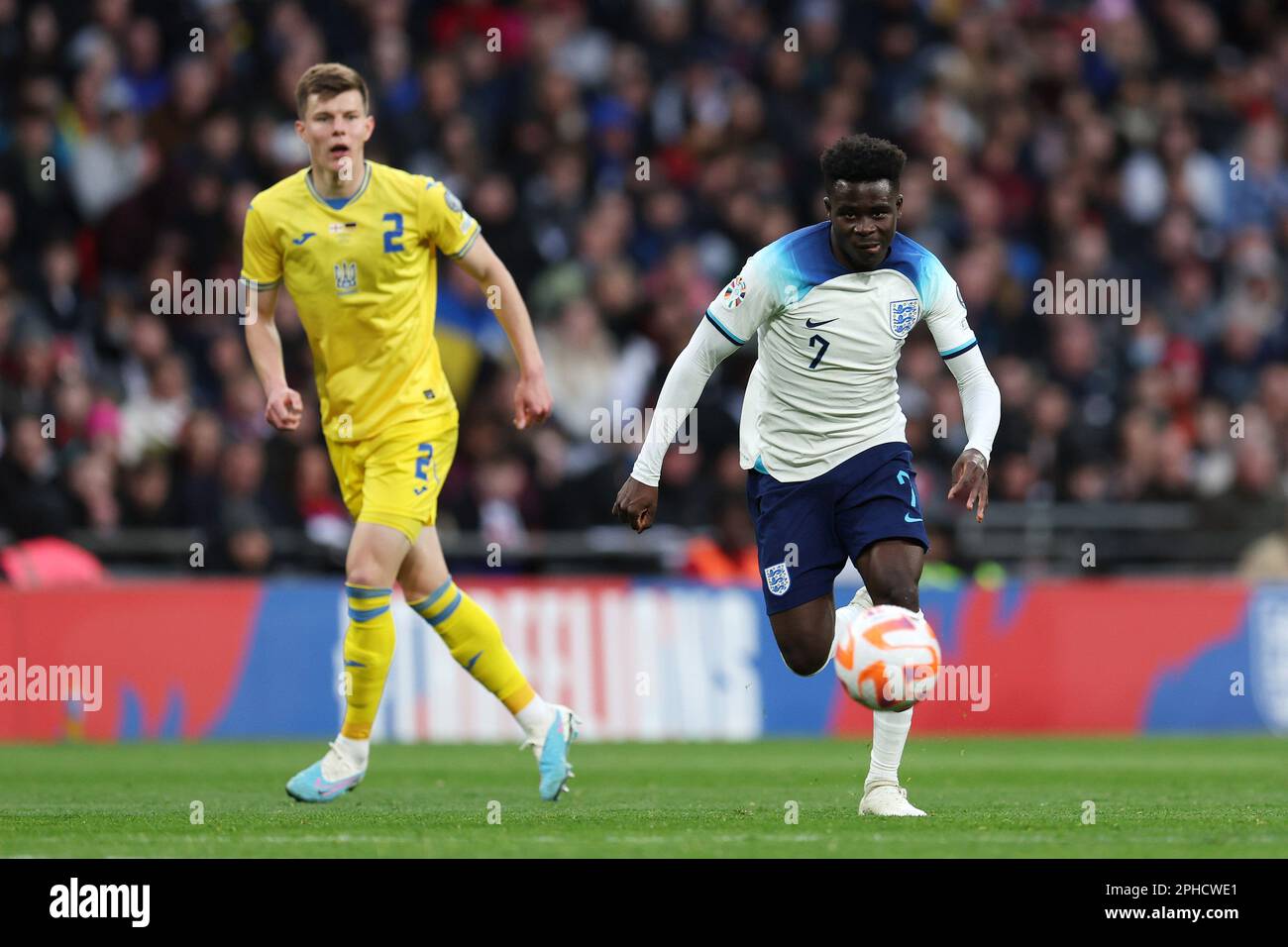 London, UK. 26th Mar, 2023. Bukayo Saka of England (r) in action ...
