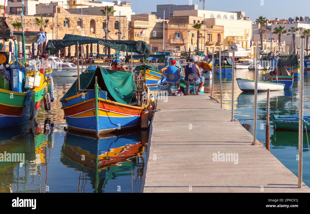 Colorful Luzzu fishing boats in traditional coloring in the harbour ...