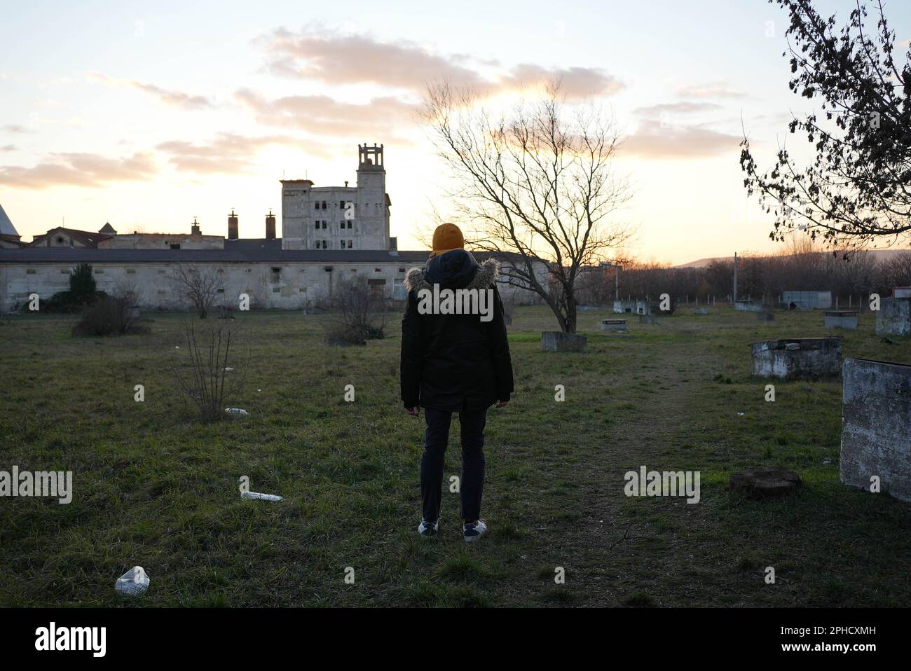 real slender man alone in front of scary building at an abandoned park ...