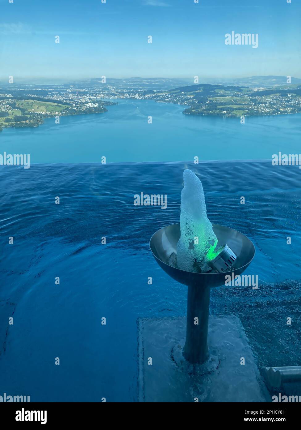 Infinity Swimming Pool with Mountain and Lake Lucerne View in a Sunny ...