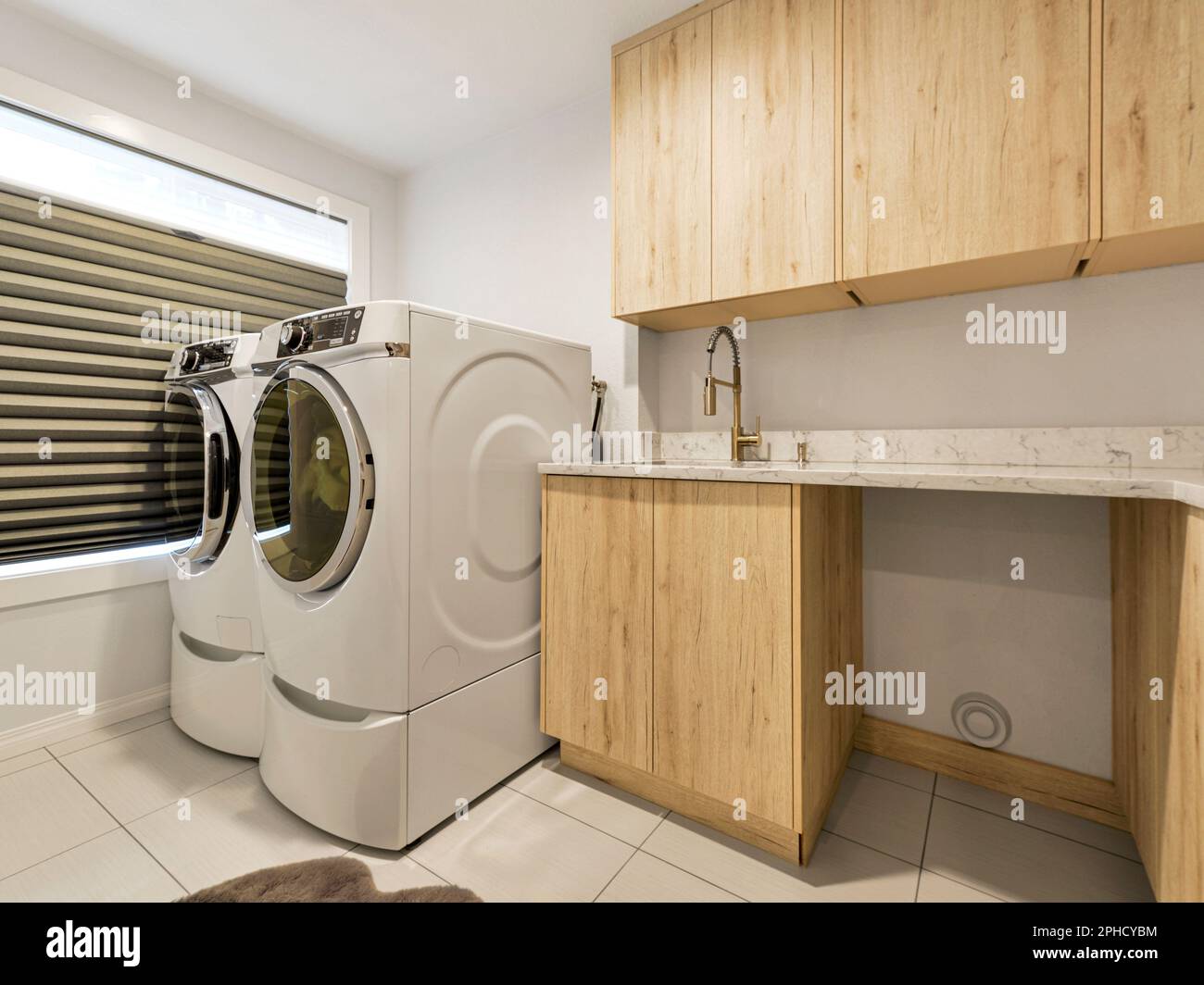 Modern residential laundry room interior Stock Photo - Alamy