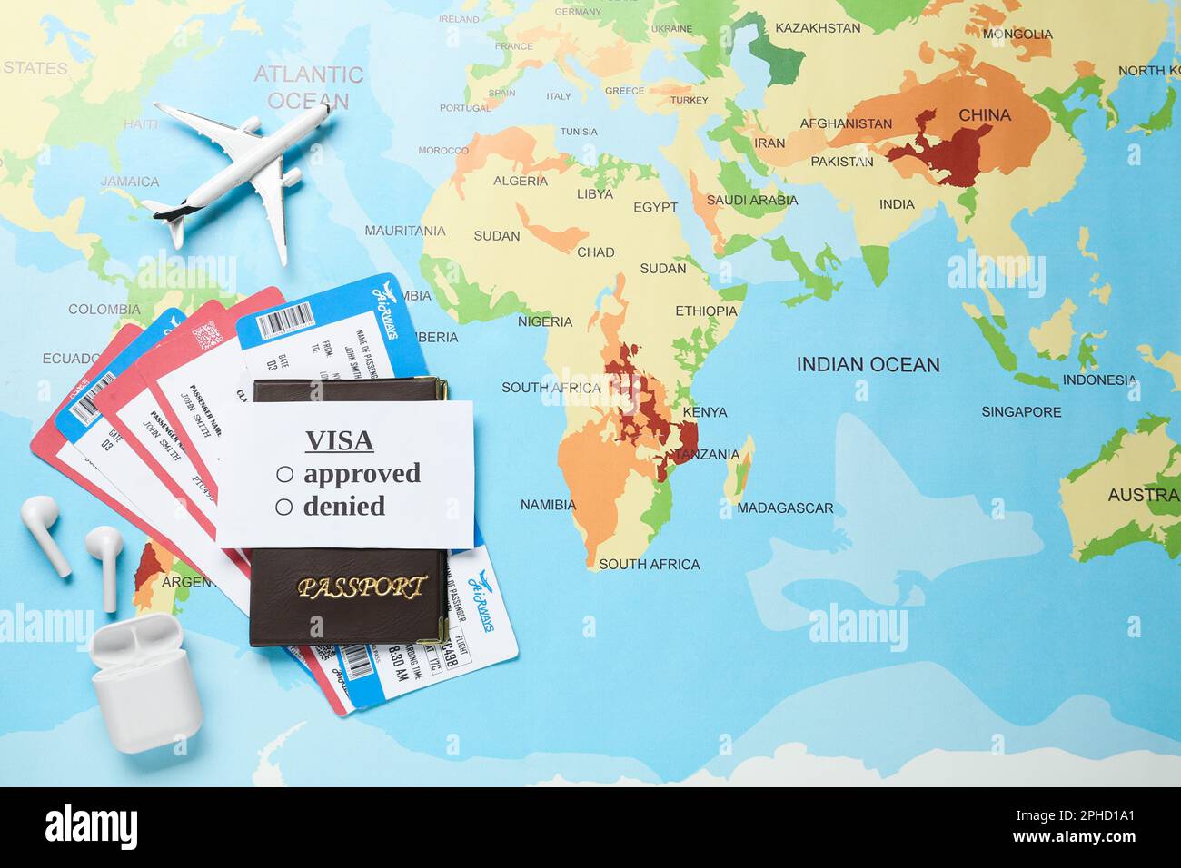 Flat lay composition with passport and tickets on world map. Space for ...