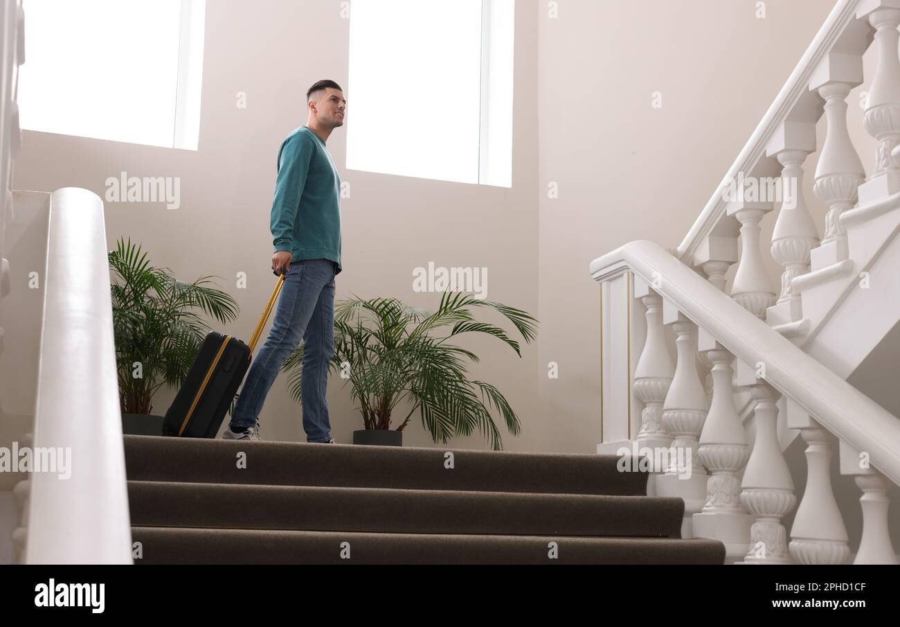 Guest going up stairs hi-res stock photography and images - Alamy