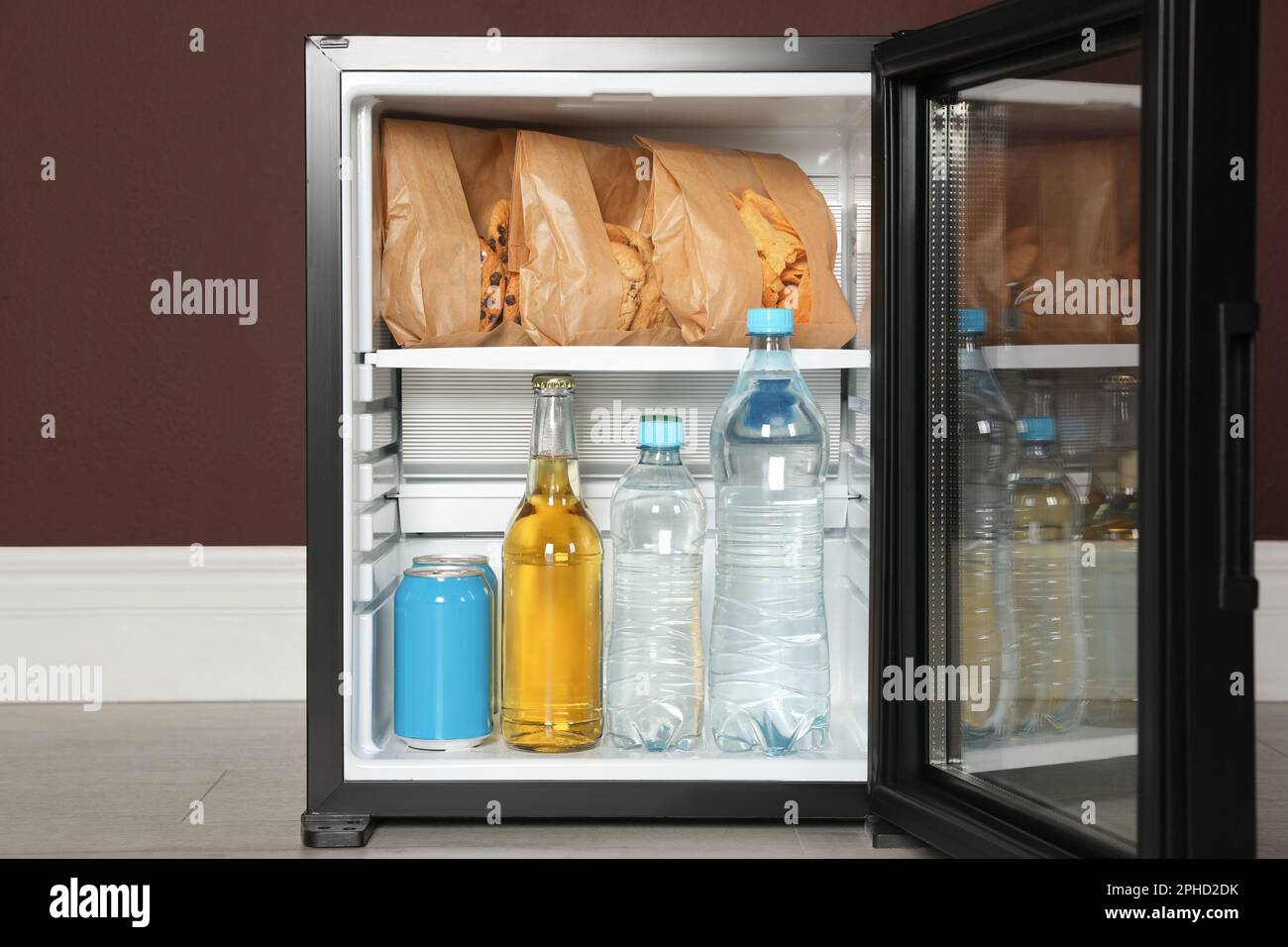 Mini bar filled with food and drinks indoors, closeup Stock Photo - Alamy