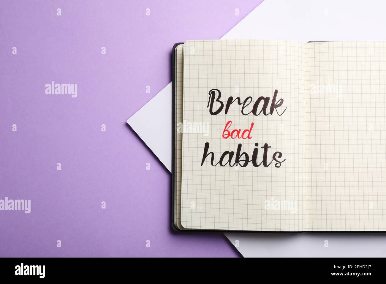 Open notebook with phrase Break bad habits on violet background, top ...