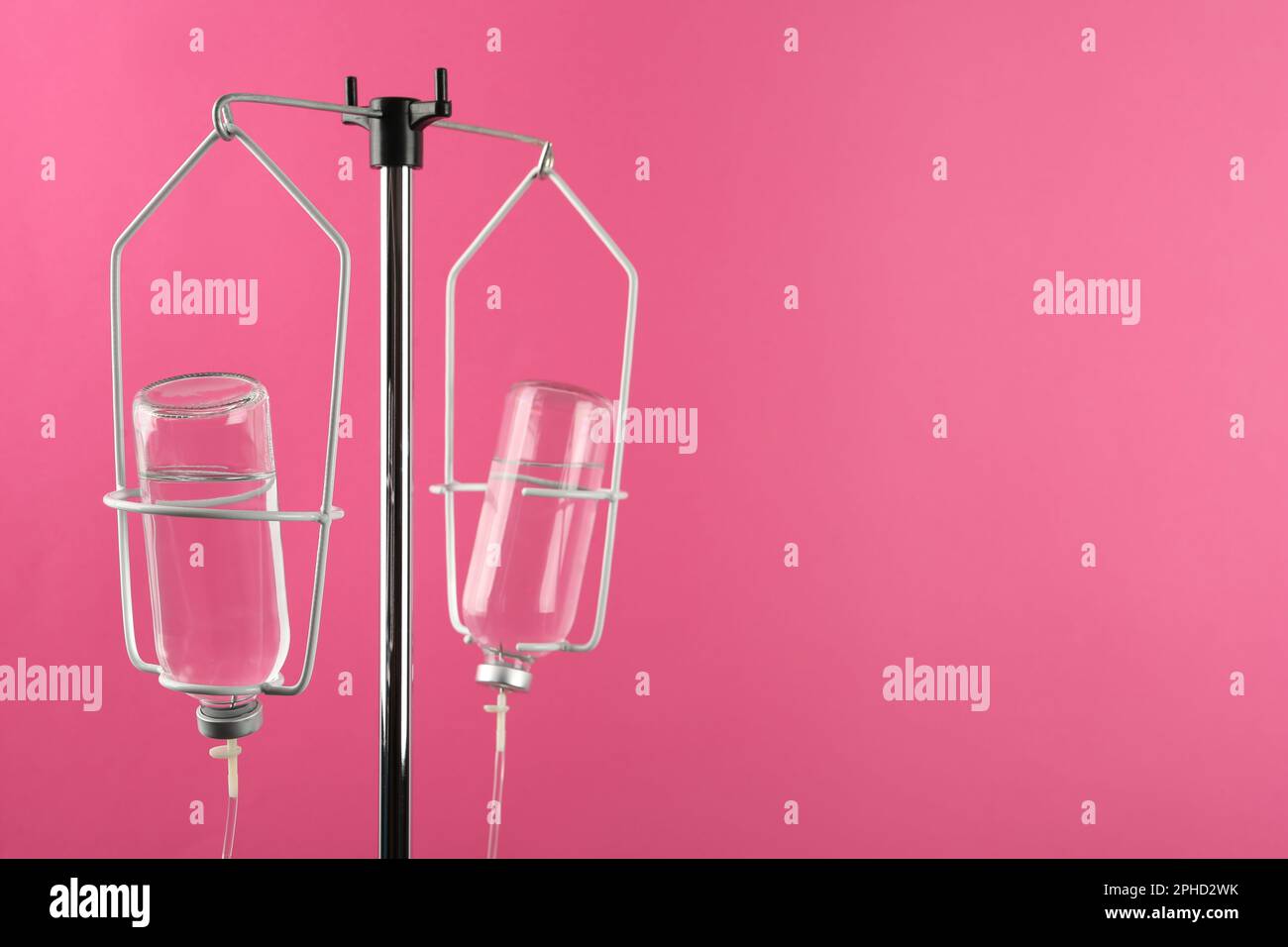 IV infusion set on pink background. Space for text Stock Photo - Alamy