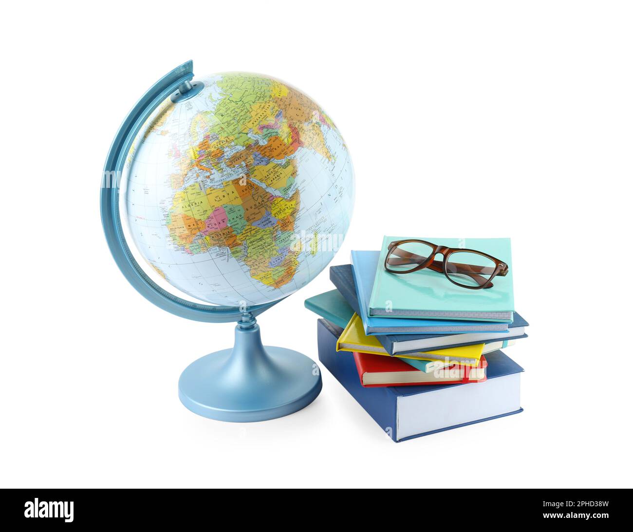 Plastic model globe of Earth, books and eyeglasses on white background ...