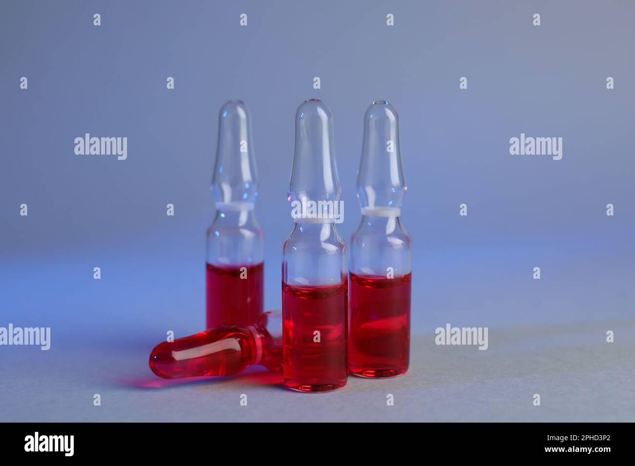 Pharmaceutical ampoules with medication on color background Stock Photo ...