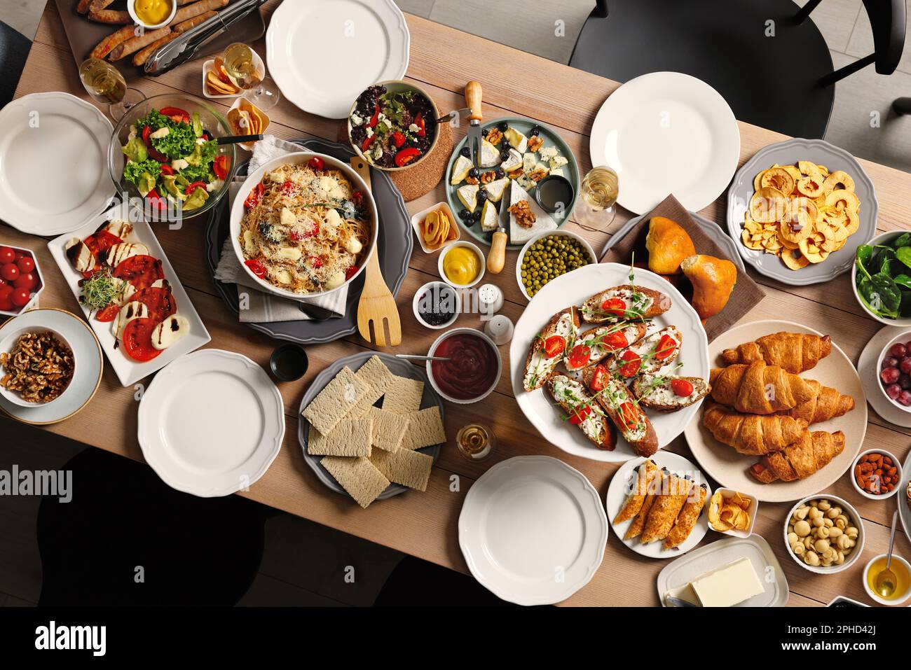 Brunch table setting with different delicious food indoors, top view ...