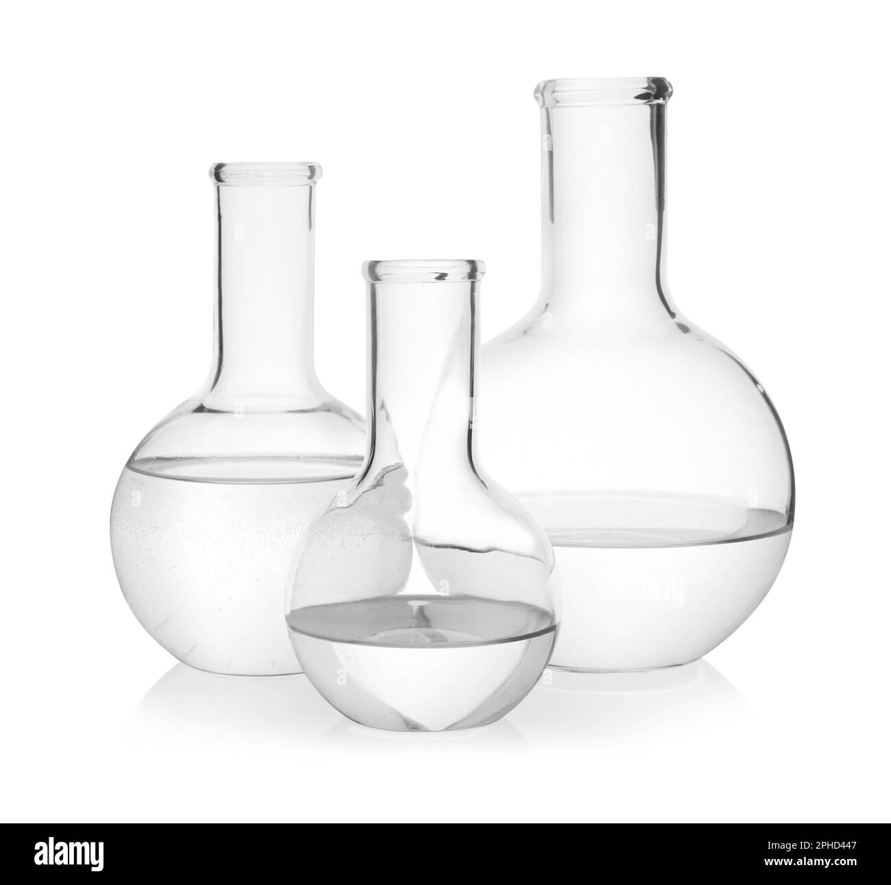 Flasks with transparent liquid on white background Stock Photo - Alamy