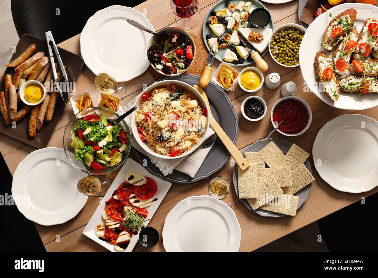 Brunch table setting with different delicious food indoors, top view ...