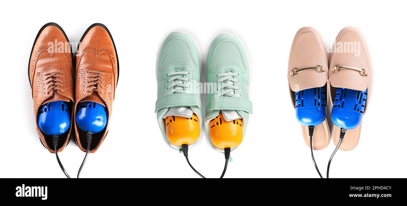 Top view of dIfferent stylish footwear with electric shoe dryers on ...