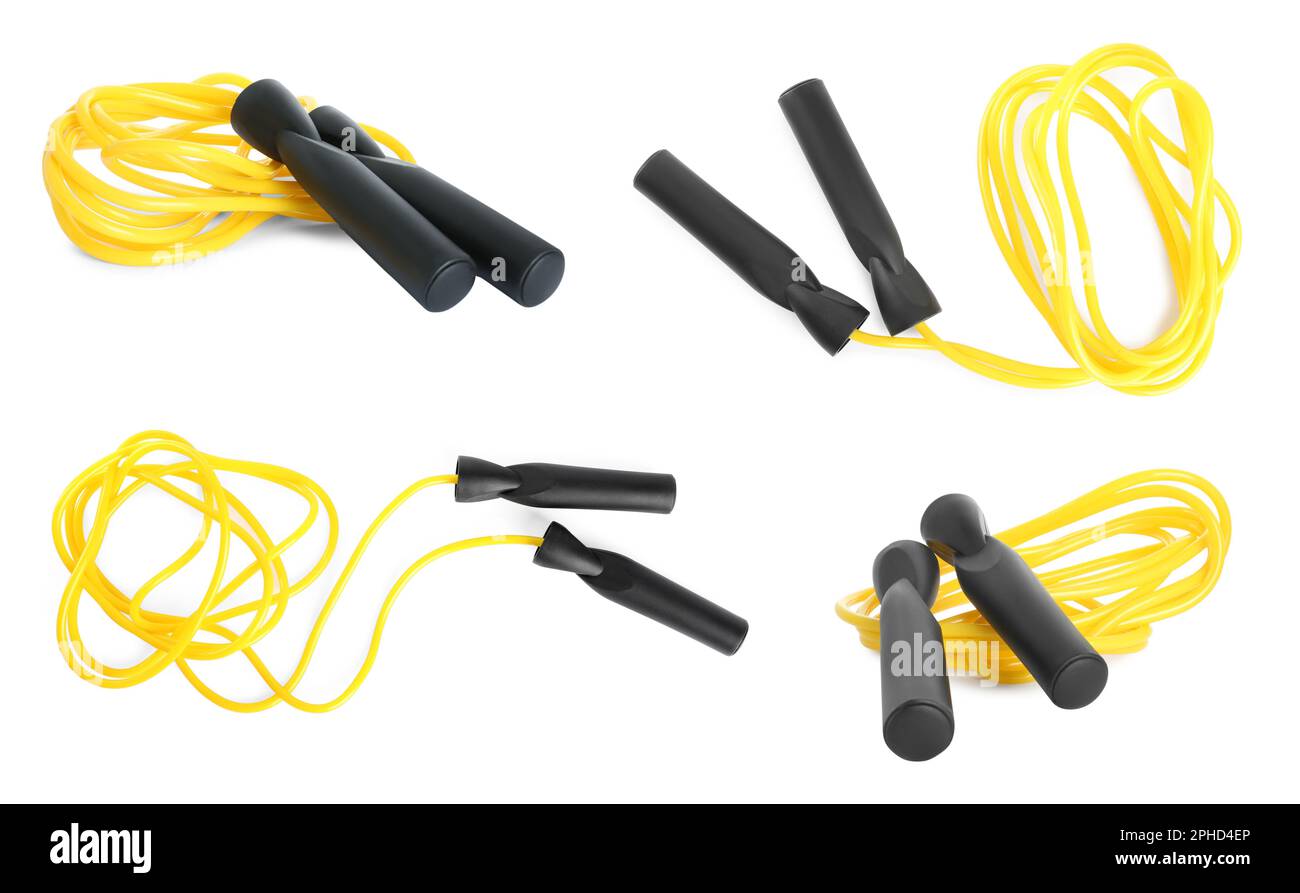 Set with yellow skipping ropes on white background Stock Photo - Alamy