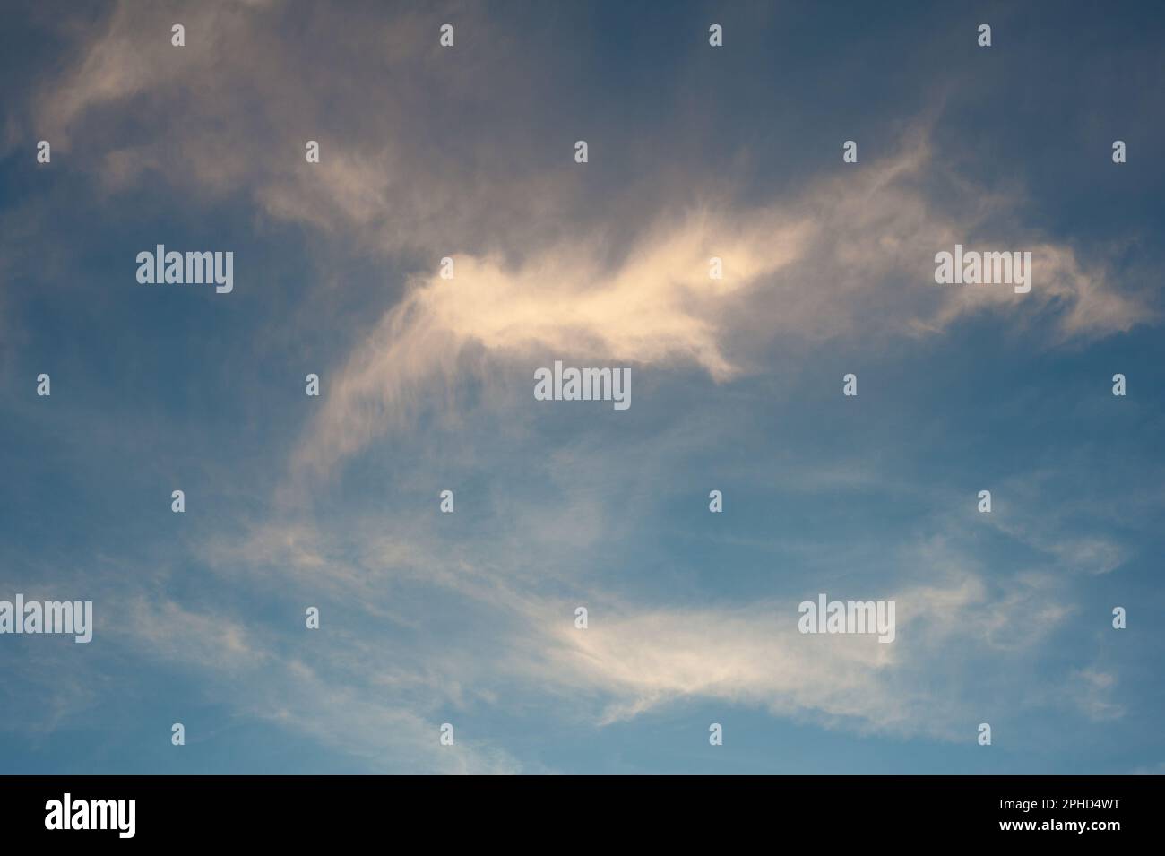 Wispy Cirrus clouds in deep blue sky Stock Photo - Alamy