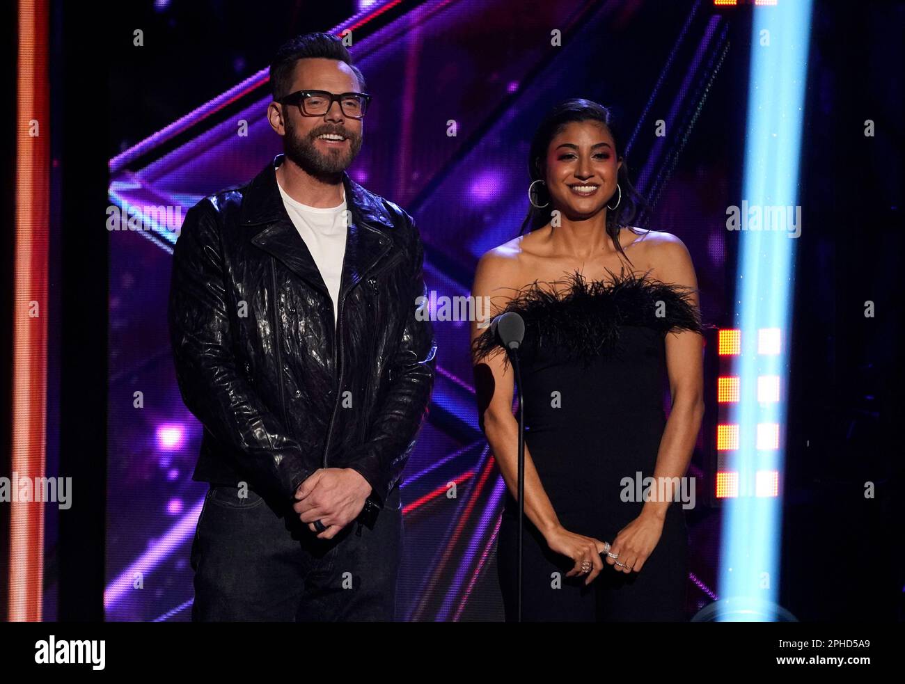 Joel McHale, left, and Vella Lovell present the award for country song ...