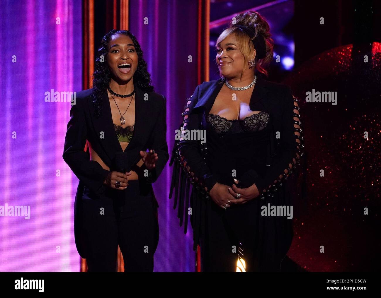 Chilli, left, and T-Boz, members of TLC, introduce a performance by ...