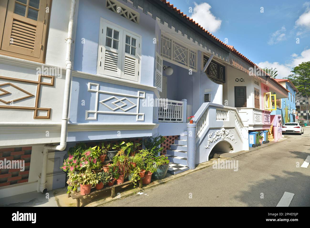 Ornate conserved single-storey terrace house built on raised ground ...