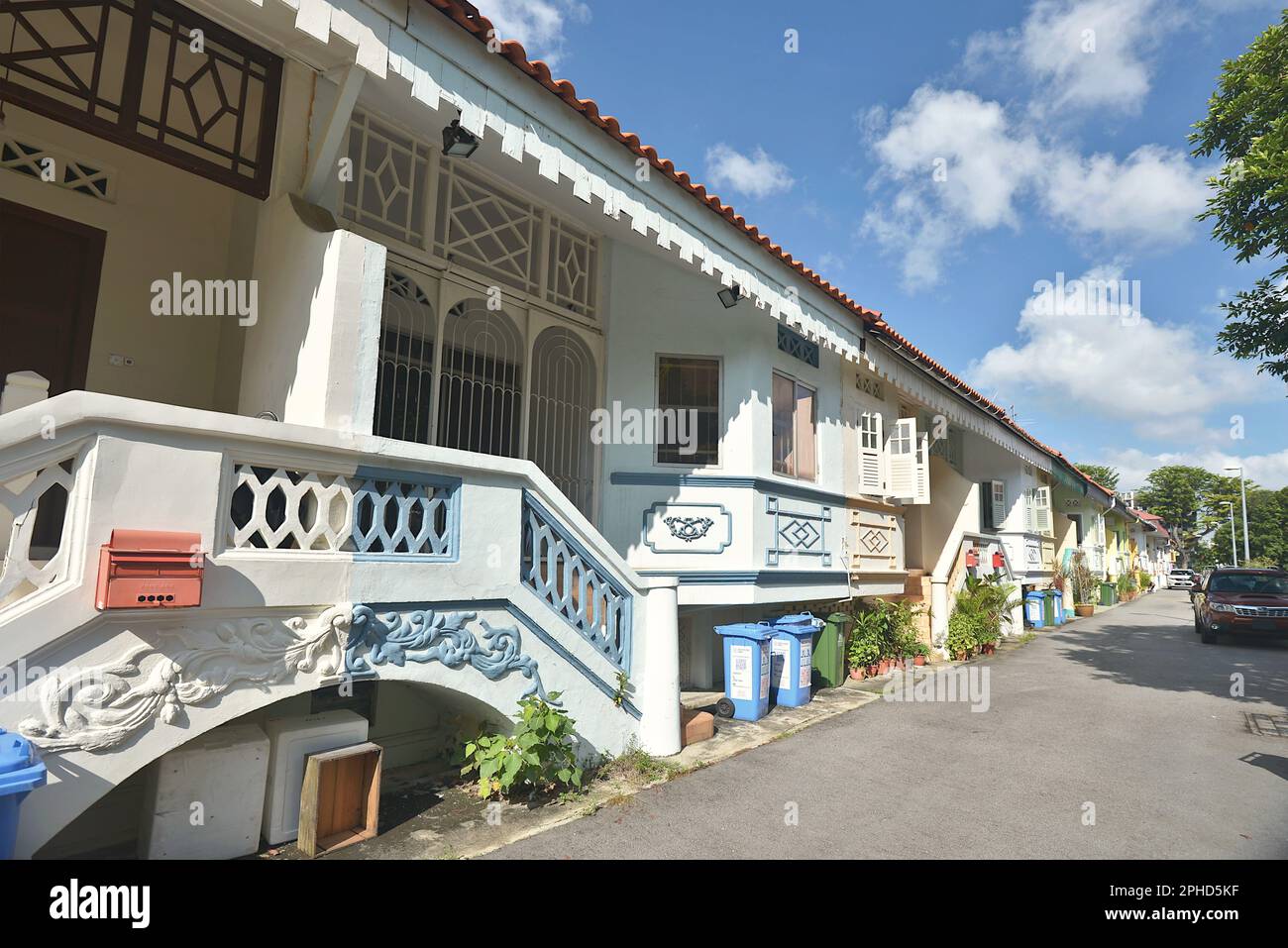 Conserved single-storey terrace houses built on raised ground along ...