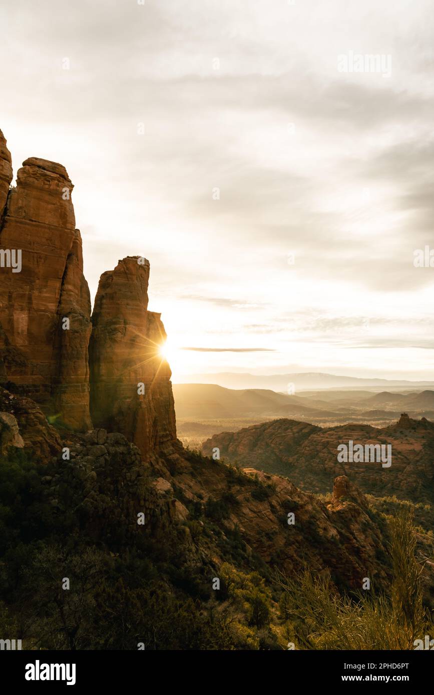 Sun flare on rock spires at the top of cathedral rock in Sedona Arizona ...