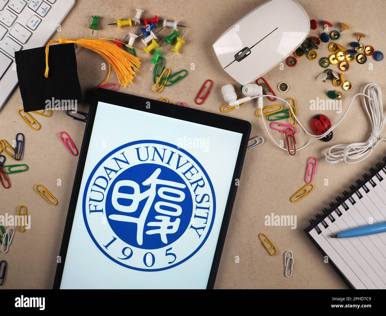 In this photo illustration, Fudan University logo seen displayed on a ...