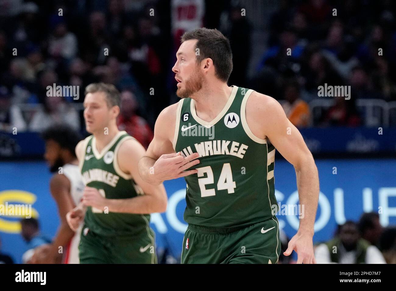 Milwaukee Bucks guard Pat Connaughton reacts after a three-point basket ...