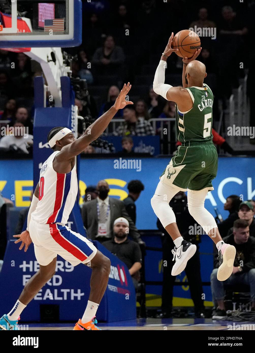 Milwaukee Bucks guard Jevon Carter (5) shoots over the defense of ...