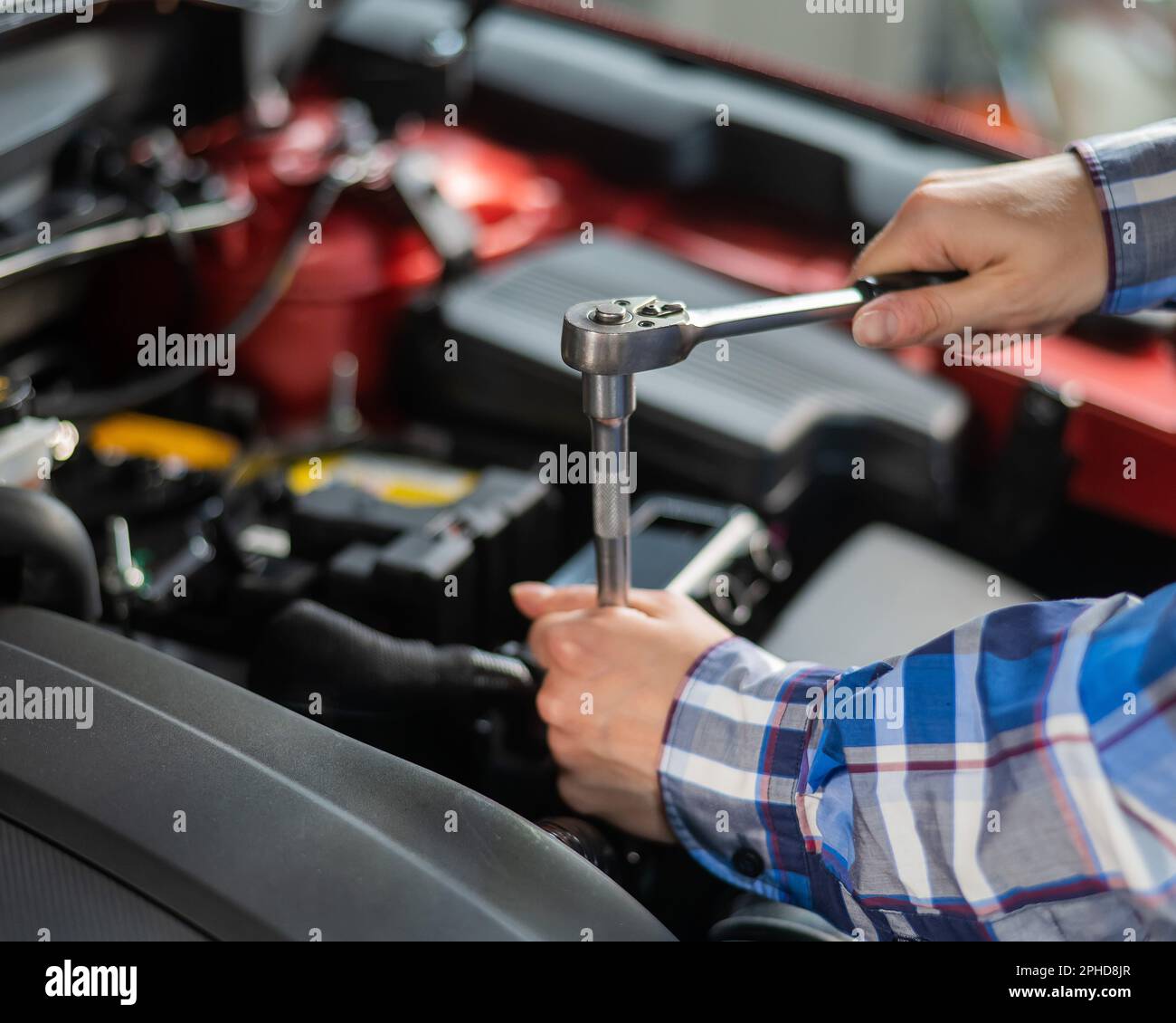 Woman car mechanic unscrews hi-res stock photography and images - Alamy