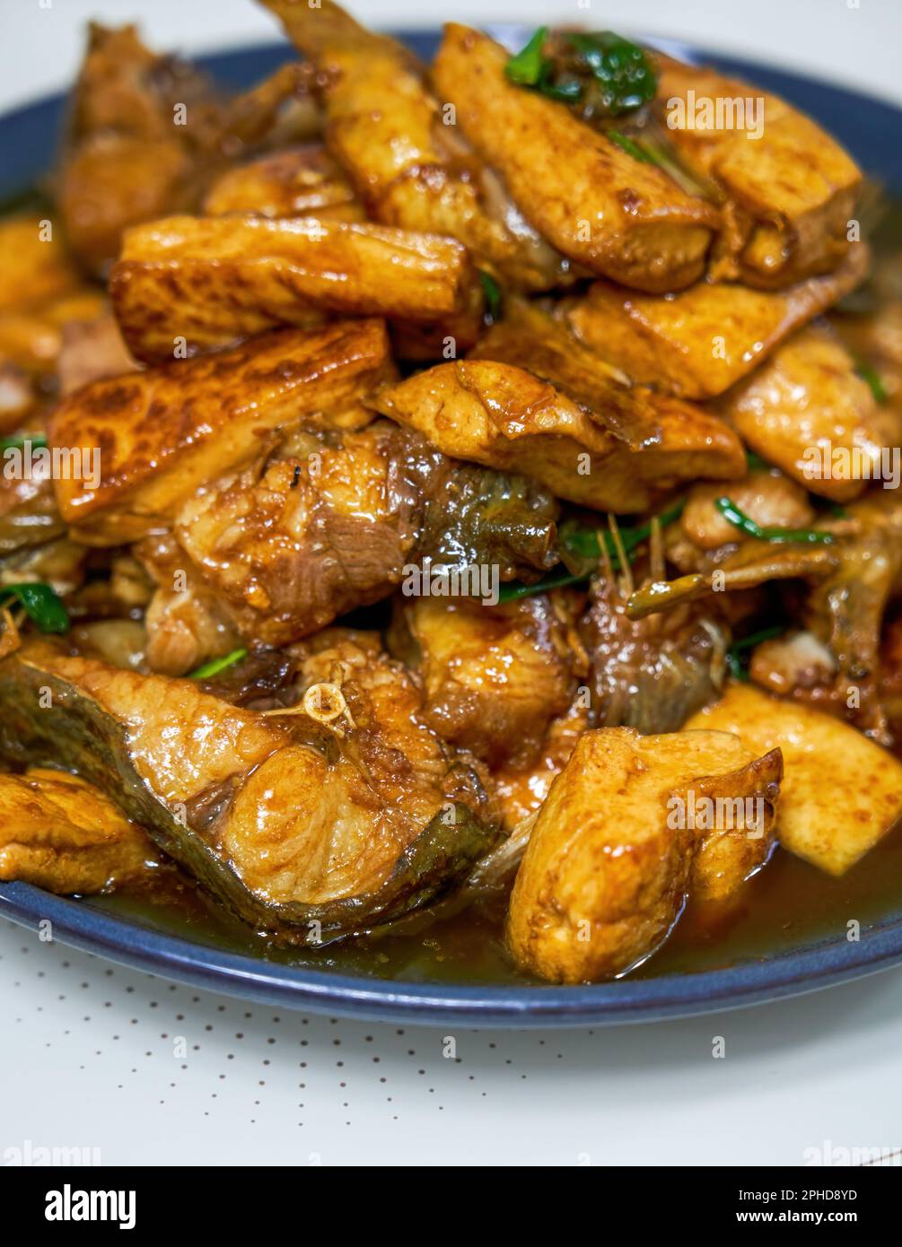 A dish of delicious Chinese home cooking, Braised Catfish with Tofu ...