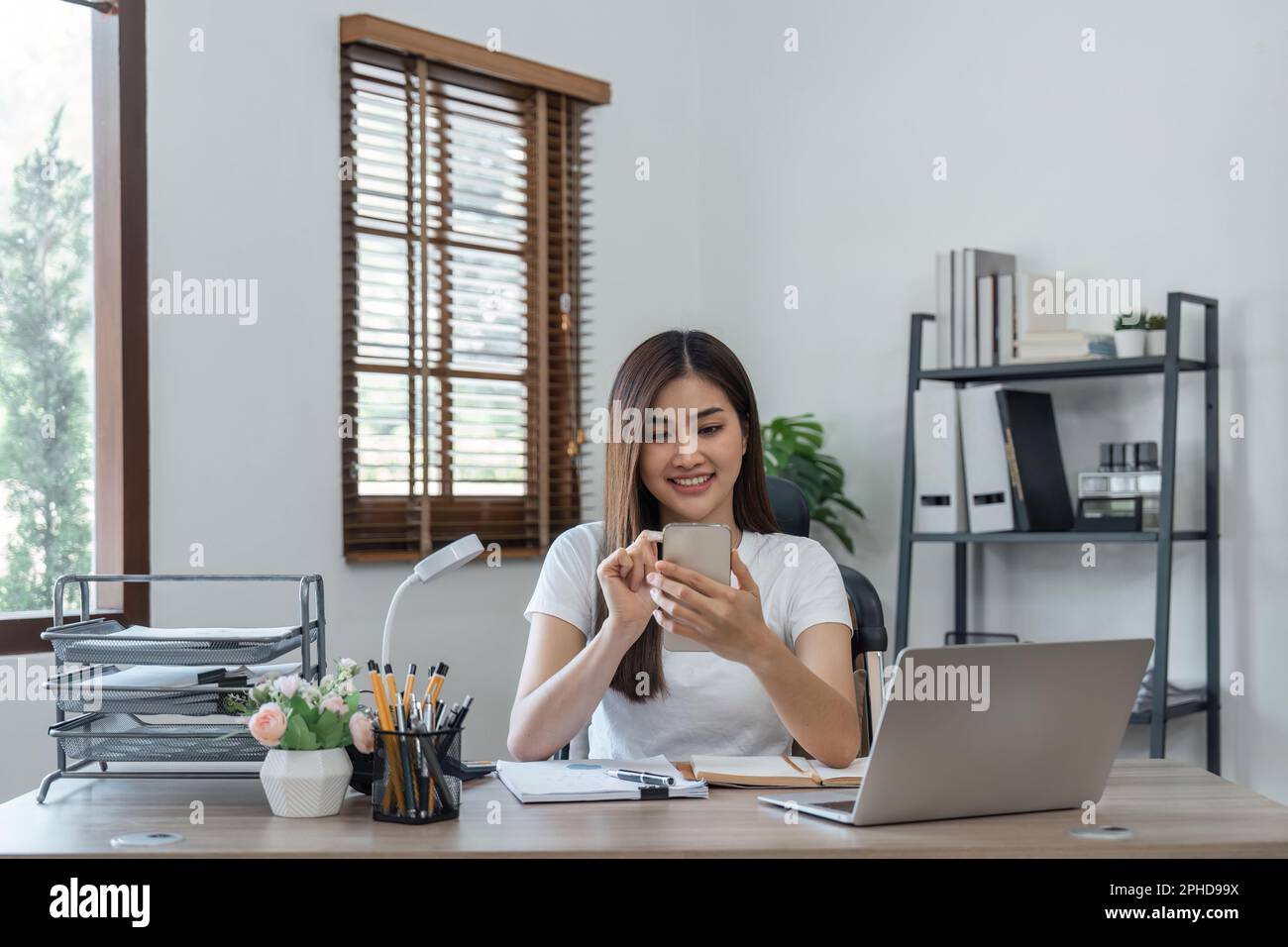 business woman with phone for communication, connection and typing ...