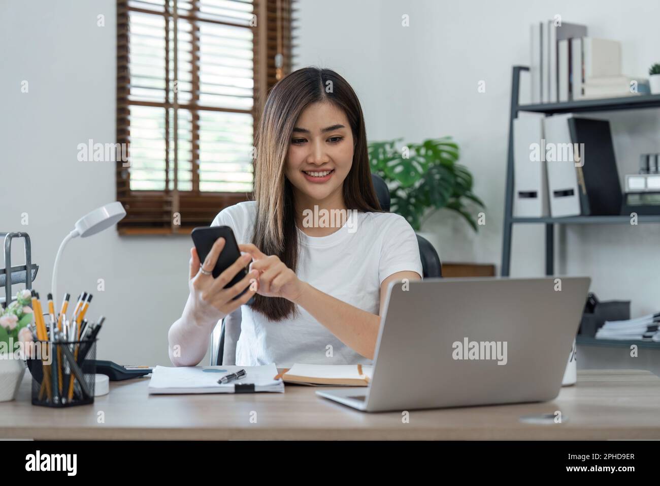 business woman with phone for communication, connection and typing ...