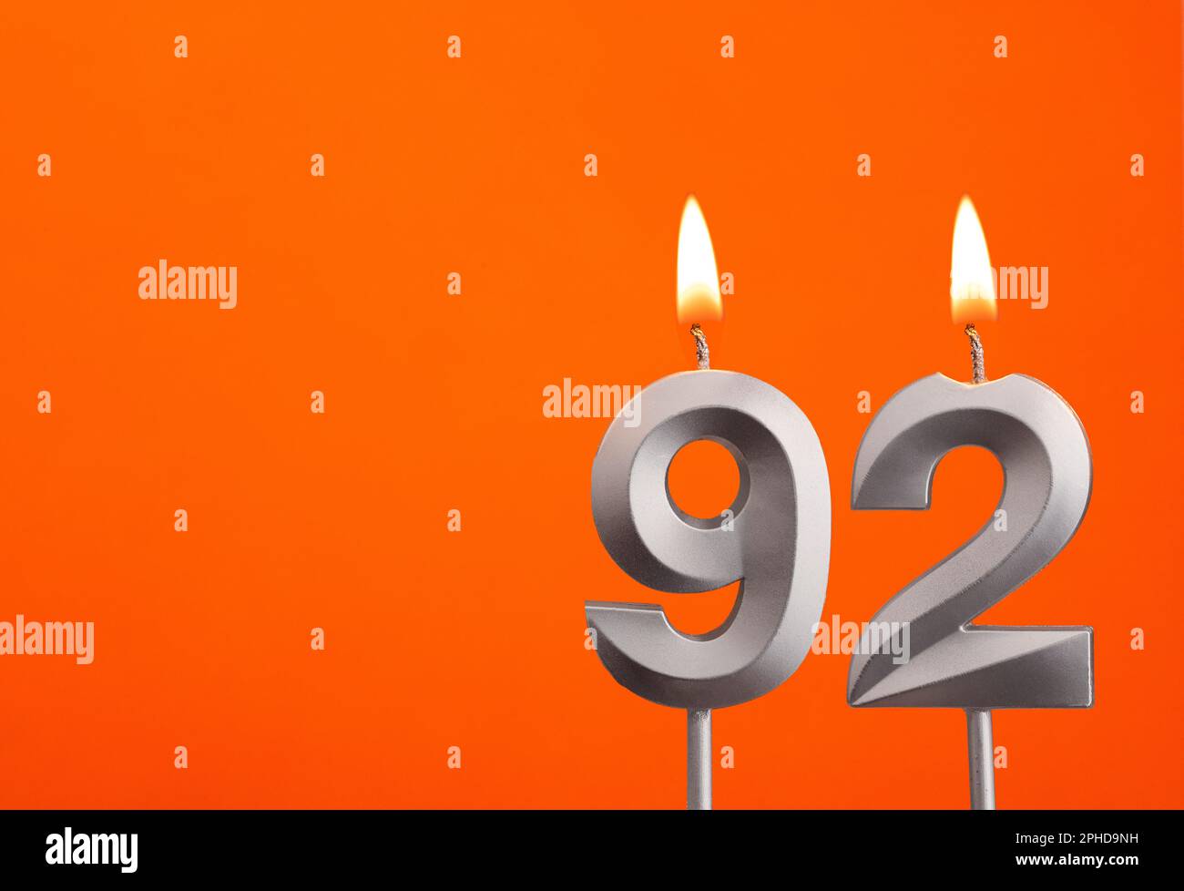 Candle number 92 - Birthday in orange background Stock Photo - Alamy