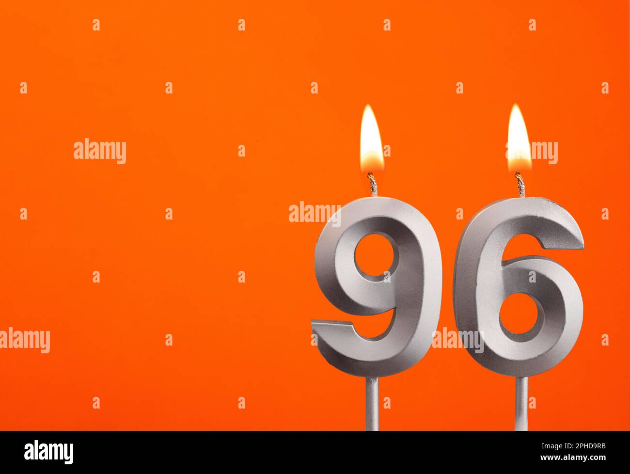 Candle number 96 - Birthday in orange background Stock Photo - Alamy