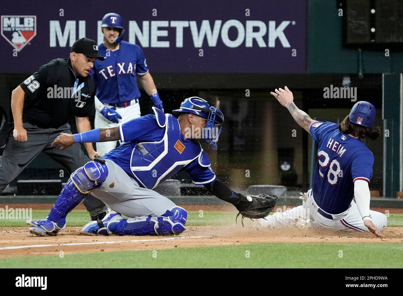 Texas Rangers' Jonah Heim (28) avoids a tag by Kansas City Royals ...