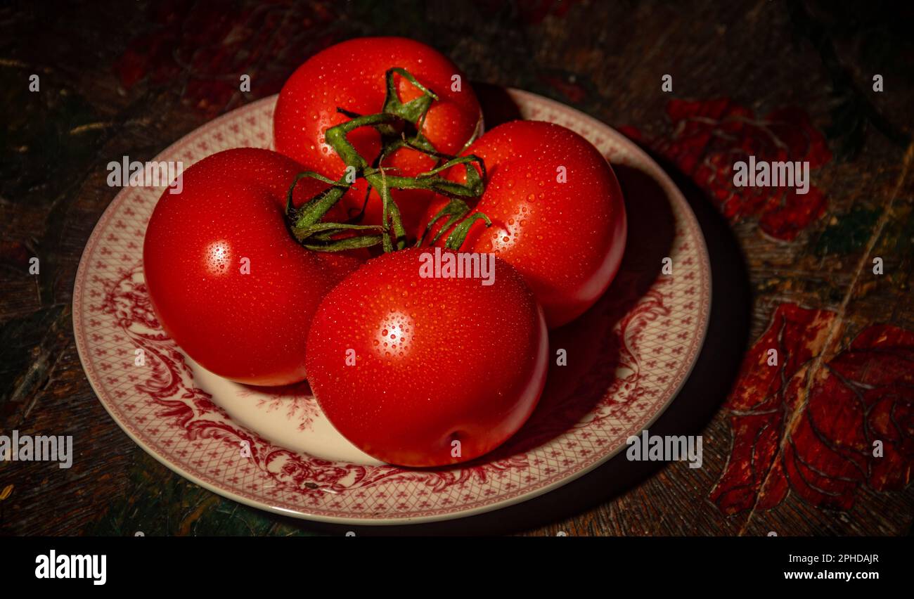 Tomatoes on the Vine Stock Photo - Alamy