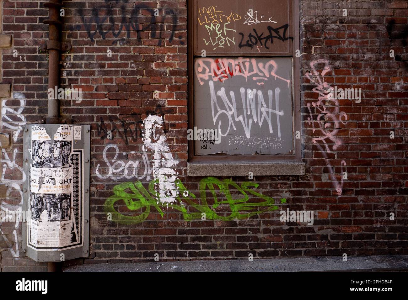 Downtown Seattle Alleyway with colorful Graffiti and paper prints on ...