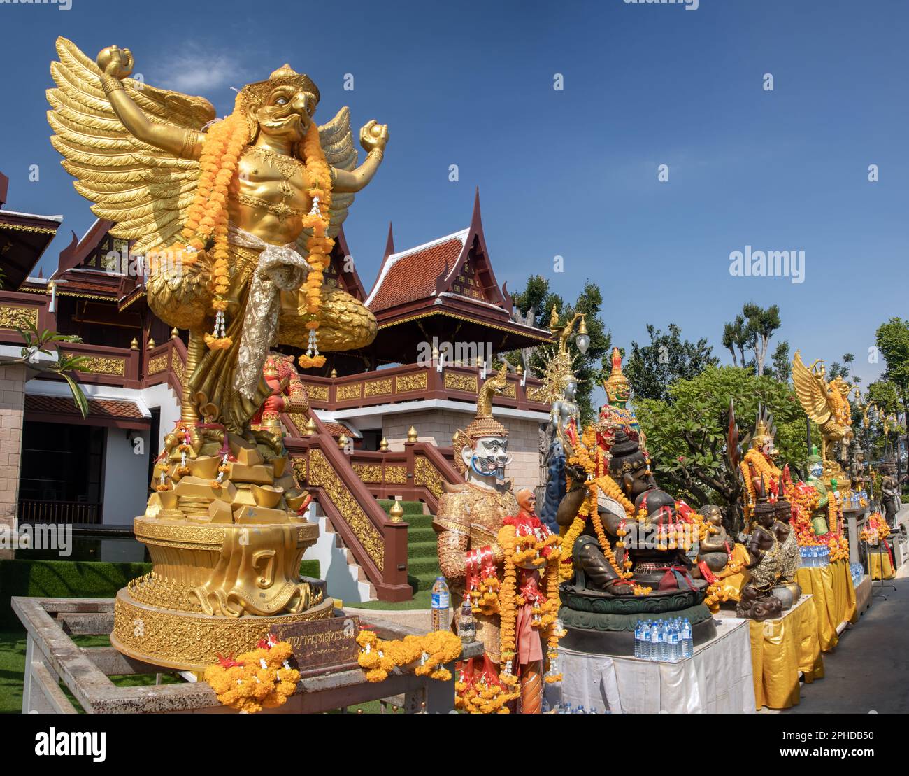 Religious statues with Garuda in the foreground at Buddhist temple Wat ...