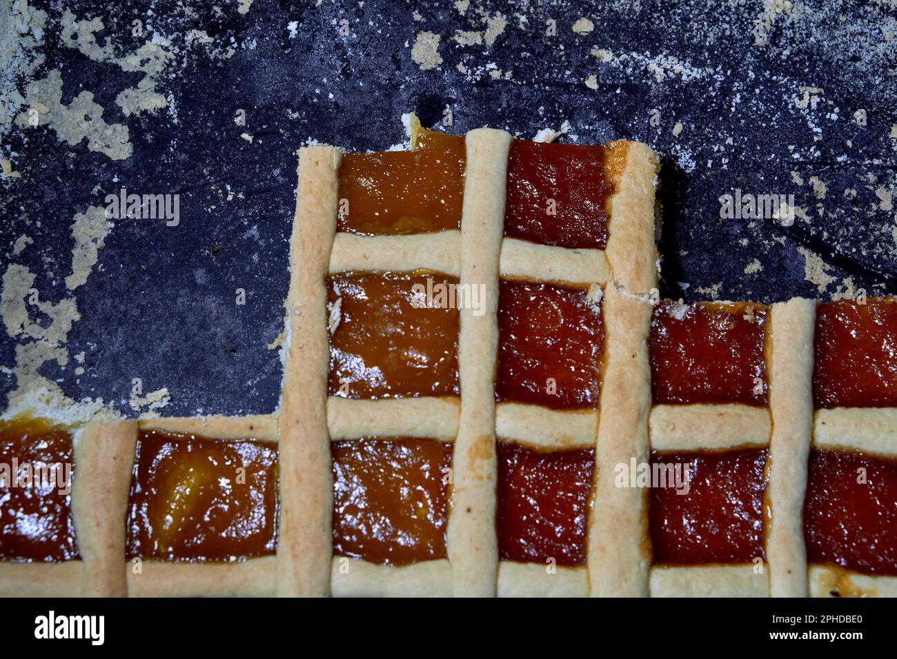 Close-up of a warm half of a homemade Pasta Frola filled with quince ...
