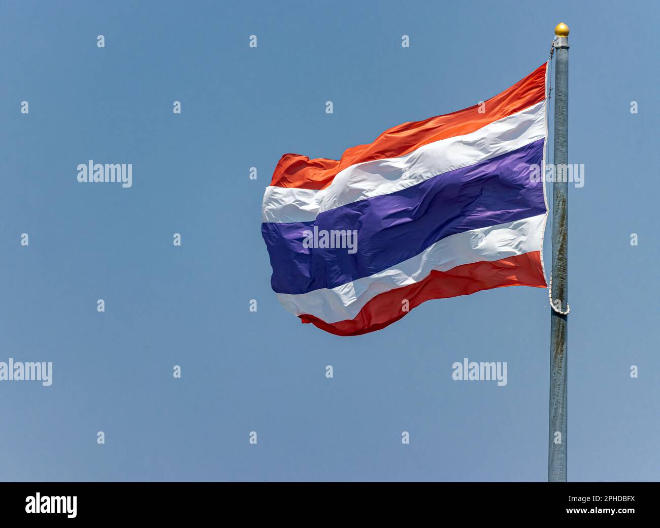 The national flag of Thailand is flying against the blue sky Stock ...