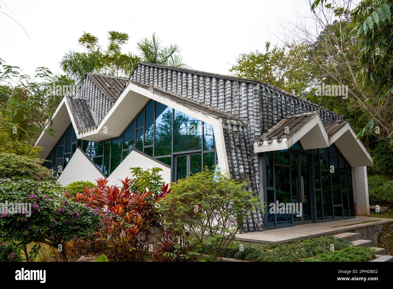 An angular modern building in a forest Stock Photo - Alamy